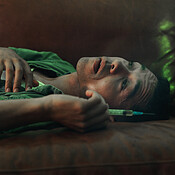 Drugs, overdose and man on sofa with needle, health risk and narcotic ...