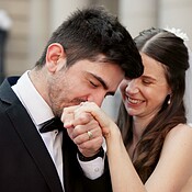 Smile, couple and kiss on hand for wedding with promise, celebration ...