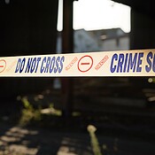 Crime scene, police tape and warning in building for investigation with ...