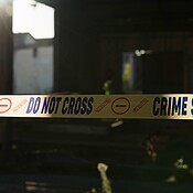 Crime scene, police tape and caution in building for investigation with ...