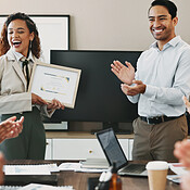 Office, woman and man with clapping hands at award ceremony for ...
