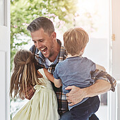 Happy, father and children with hug by door for welcome, greeting and ...