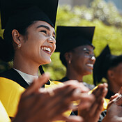 Students, happy and applause at university for graduation, peer support ...
