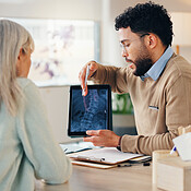 Xray, spine and tablet screen with doctor and old woman for consulting ...