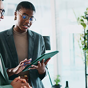 Teamwork, consultant and tablet with business people in office for ...