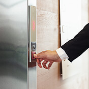 Hands, office and person press elevator, transport technology and arrow ...