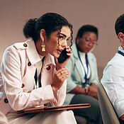 Audience, distraction and phone call with business people in conference ...