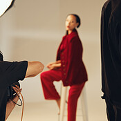 Man, photographer and camera for photoshoot in studio of photography ...