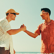 Happy, men and friends with handshake on beach of greeting, meeting and ...