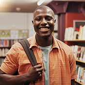 African man, student and smile at library, portrait or excited for ...
