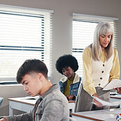 Exam, high school and teacher in classroom with paper, test and ...