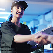 Security, woman and handshake in office for greeting, welcome or ...