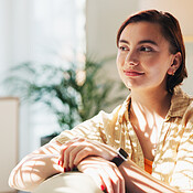 Woman, smile and thinking in home, living room and reflection with ...