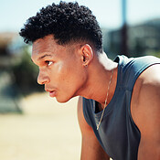 Ready, competition and athlete or man on race track for fitness ...