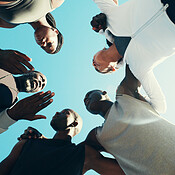 Huddle, running and coaching with friends in city for support, fitness ...