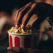 Hands, popcorn and snack at cinema in crowd for film screening, fast ...