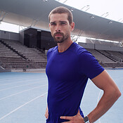 Runner, portrait and athlete or man on race track for fitness, marathon ...