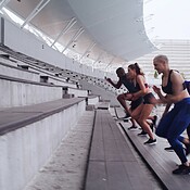 Athlete, group and running on stairs at stadium for competition ...