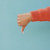 Hand and Thumb down, bad or negative crisis with a woman giving a ...