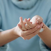 Hands, fingers and knuckle cracking of woman with carpal tunnel, wrist ...