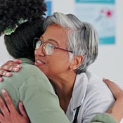 Doctor, patient and hug for healthcare appointment, consultation or ...