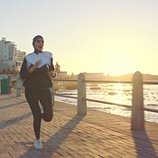 Muslim, woman and sunset running at beach for exercise, cardio workout ...