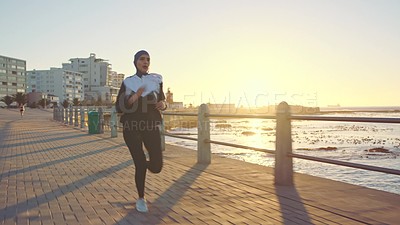 Muslim, woman and sunset running at beach for exercise, cardio workout ...
