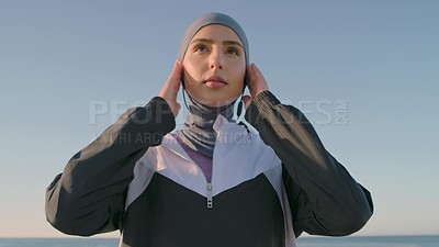 Fitness, running and face of muslim woman with headphones for music ...