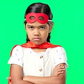 Angry, crossed arms and face of child on green screen with upset ...