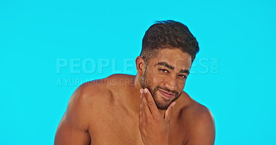 Selfie, smile and bicep muscle of man in studio isolated on a blue ...