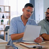 Business, men and employees with documents, talking and explain process ...