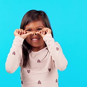 Funny face, laughing and a child on a green screen for comedy ...