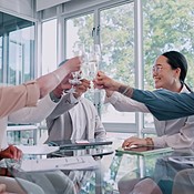 Champagne, cheers and business people in celebration in the office ...