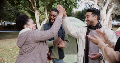 Happy, applause and friends with a high five while camping for win ...