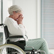 Sad, senior woman and person with disability, wheelchair and crying ...