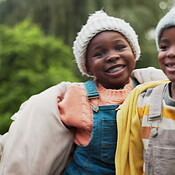 Black family, kids and hug with boys outdoor on a street in their ...