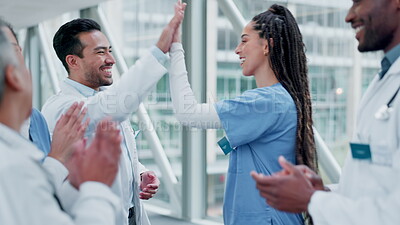 Paper, applause and teamwork with doctors in hospital for celebration, medical and support. High ...