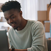 Black man, small business and laptop, typing and e commerce ...