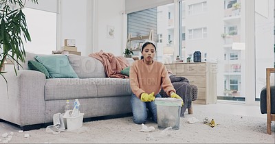 Cleaning, trash can and garbage with woman in living room for hygiene ...