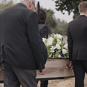 Coffin, men and pallbearers walking at graveyard ceremony outdoor at ...