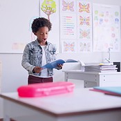Child, kid reading and classroom with talking speaker, book and ...