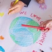 Children in classroom, drawing and art from above for earth day, eco ...