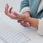 Computer keyboard, hands and business person with carpal tunnel ...