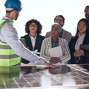 Architecture, business people and designer with blueprint for project ...