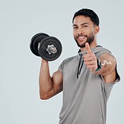 Man, weightlifting with dumbbell and bodybuilder, thumbs up and smile ...