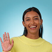 Face, smile and woman with greeting, wave and communication on a blue ...