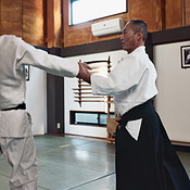 Aikido, sensei and master in a fight of martial arts with student in ...