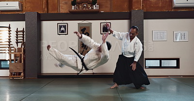 Aikido, sensei and master in a fight of martial arts with student in ...
