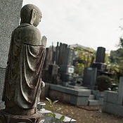 Stone statue in traditional Japanese cemetery with peace, calm and ...