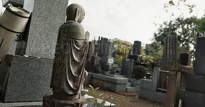 Stone statue in traditional Japanese cemetery with peace, calm and ...